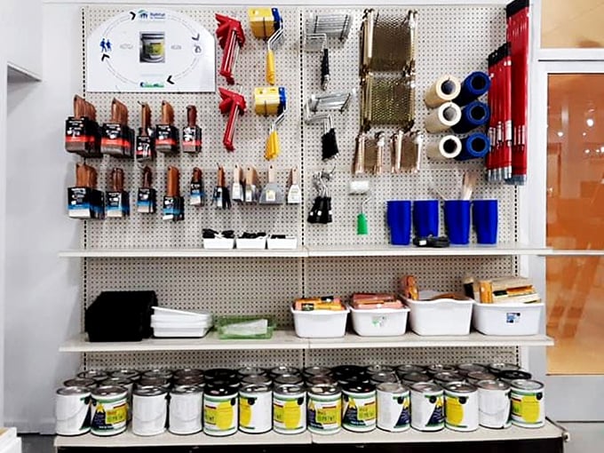 A pegboard paradise of painting supplies that would make Bob Ross jump for joy. Happy little brushes everywhere!