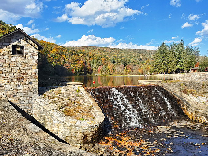 Where history meets tranquility. The stone dam creates a mesmerizing cascade while autumn-painted hillsides provide a backdrop worthy of a calendar cover.