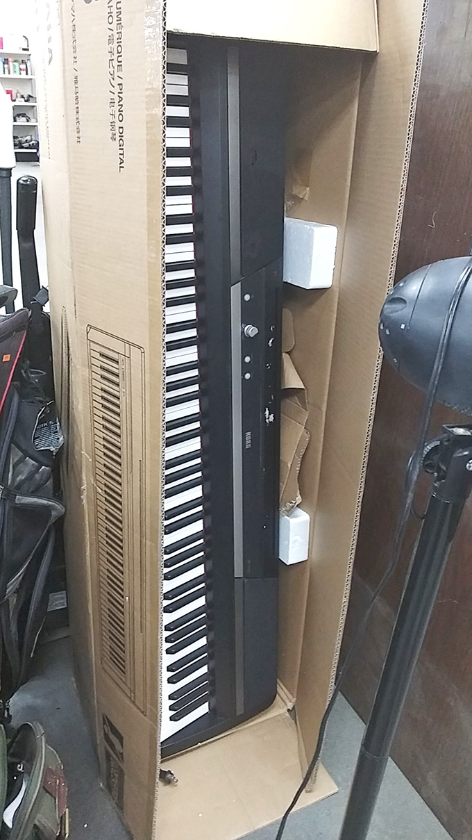 A full-sized electronic keyboard waits in its box, ready to transform someone's living room into Carnegie Hall for a fraction of retail.