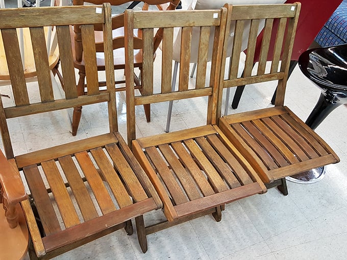 Mid-century magic in triplicate. These wooden folding chairs aren't just seating&mdash;they're time machines to Grandma's porch, waiting for their second act.