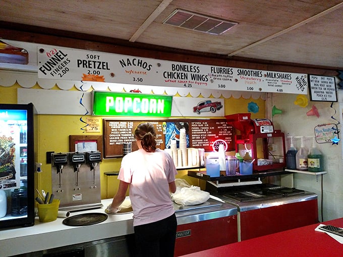 The concession counter&mdash;where movie theater popcorn actually tastes like it should and the staff remembers your order from last summer.