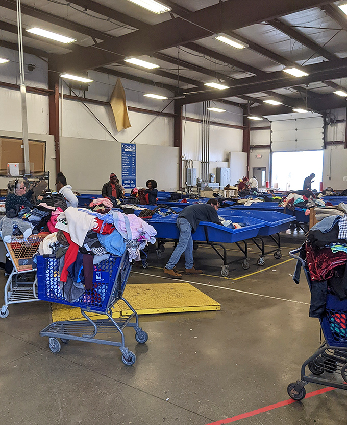 The thrill of the hunt in full display. Dedicated bargain seekers lean into bins with the focus of diamond cutters, each hoping to unearth that perfect find.