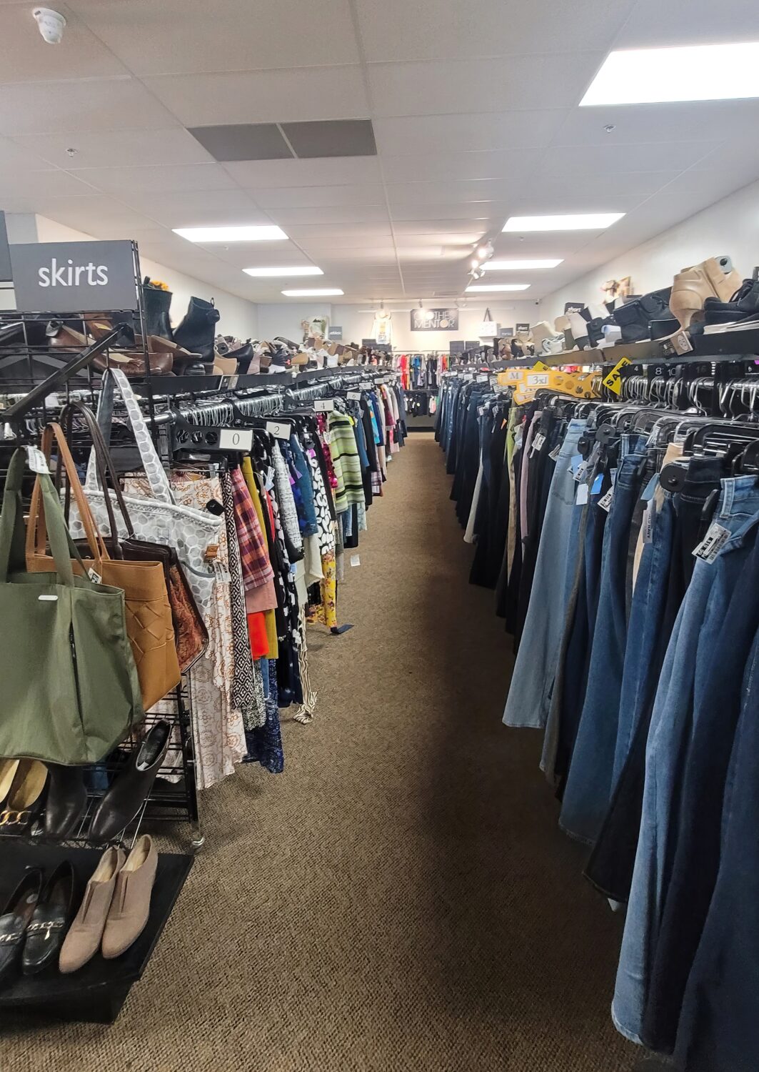 Organization is king in this thrifter's paradise, where skirts and jeans stand at attention, waiting for their second chance at fashion glory.