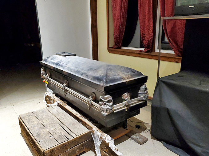 Not your average hotel amenity. This vintage coffin display adds a macabre touch to the sanatorium's current role as a paranormal destination.