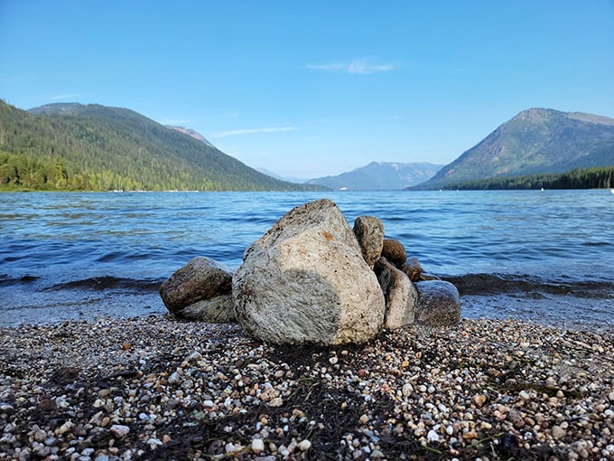 The shoreline tells stories in stone and pebble. Lake Wenatchee's beach offers a geological treasure hunt where each colorful stone has traveled glaciers to meet you.