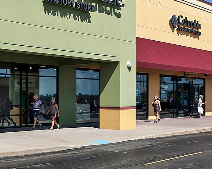 The Columbia Sportswear and Factory Store entrances stand like portals to a world where brand names and budget prices peacefully coexist.