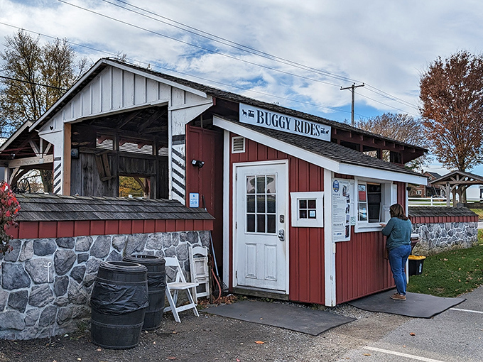 Where modern tourism meets timeless tradition&mdash;the charming red ticket booth welcomes visitors seeking a glimpse into a different way of life.