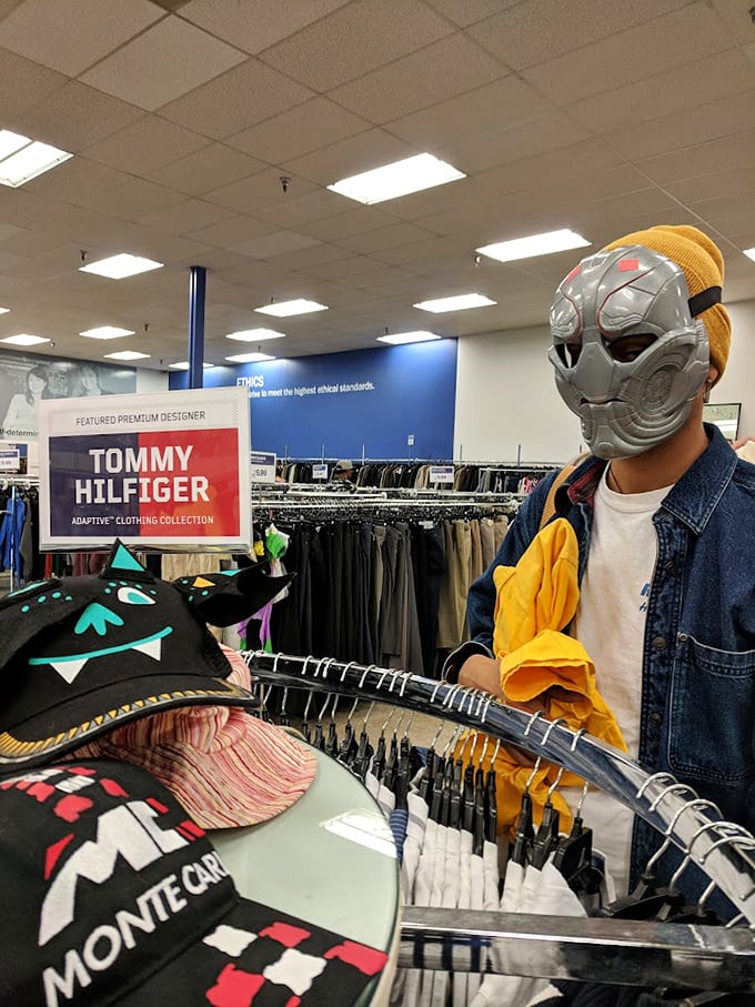 Where else can you find Tommy Hilfiger next to Halloween masks? This fashion section is like a costume party where designer labels crashed uninvited.