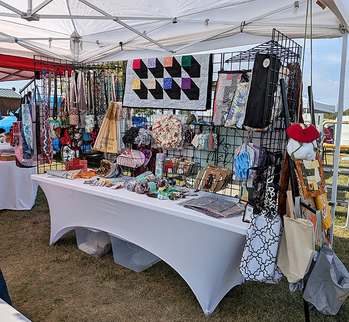 Handcrafted quilts tell stories through fabric while colorful accessories hang in wait &ndash; each stitch and pattern representing hours of Missouri craftsmanship.