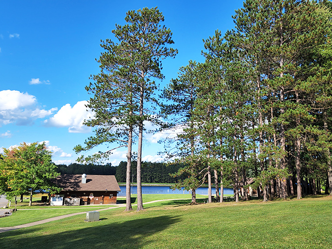 Towering pines stand sentinel around rustic cabins and glassy waters. This isn't a Bob Ross painting&mdash;it's just another Tuesday at Parker Dam.