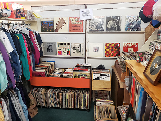 Vinyl heaven! Records stacked like pancakes at a diner, each one a time machine to someone's favorite dance, first kiss, or road trip.