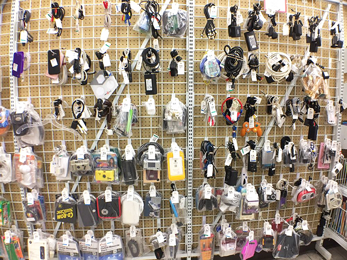 The wall of electronic lifelines! Every charger, adapter, and cable you've ever lost has mysteriously teleported here, waiting for reunion.