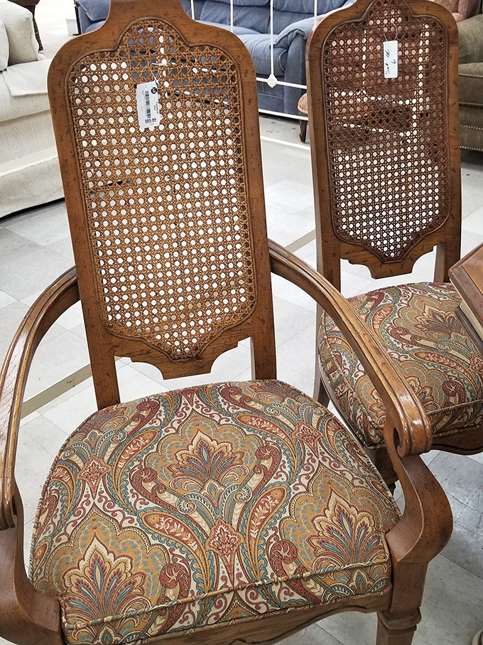 These cane-backed chairs with paisley upholstery aren't just furniture&mdash;they're time machines to Grandma's formal dining room, minus the plastic slipcovers. 