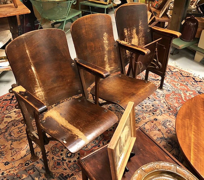 These vintage theater seats have witnessed countless performances. Now they wait for a second act in someone's home, patina and all.