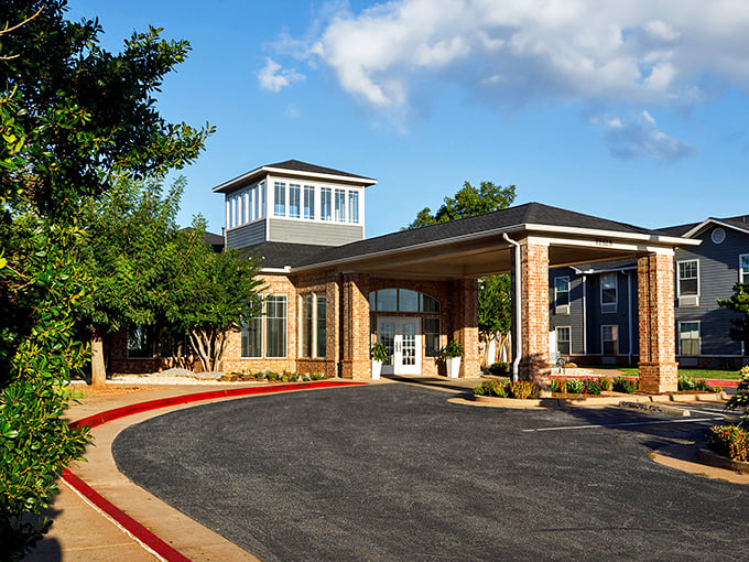Grand entrance architecture that whispers "you've arrived" without shouting about the monthly fees.