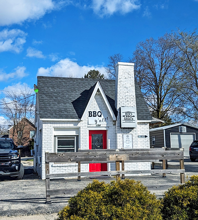 Ben's BBQ Shack looks like a fairy tale cottage that traded happily-ever-after for happily-ever-smoker. That white chimney isn't just architectural &ndash; it's functional BBQ magic.