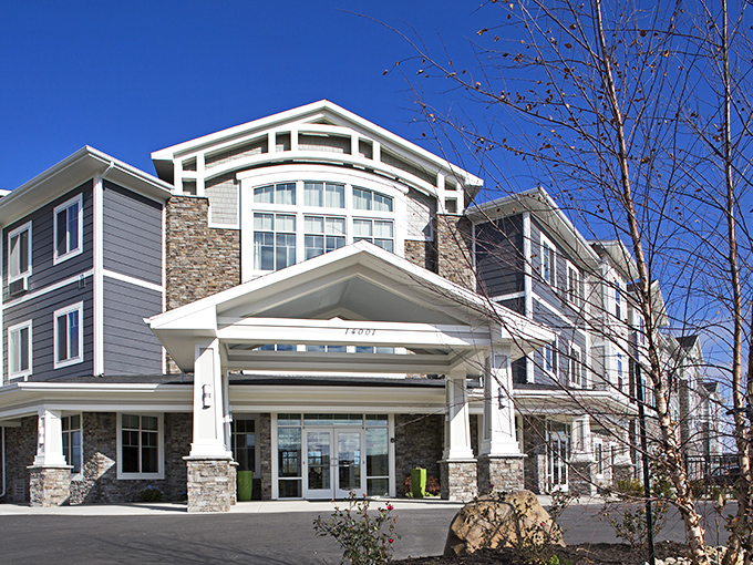 Stone and glass architecture that whispers "upscale" without shouting "expensive" - smart design for smart living.