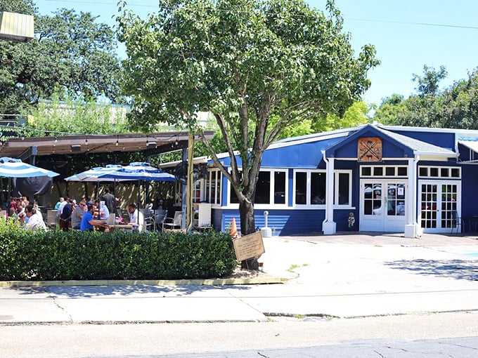 Blue Oak's outdoor picnic tables under string lights create the perfect setting for making new friends over plates of brisket.