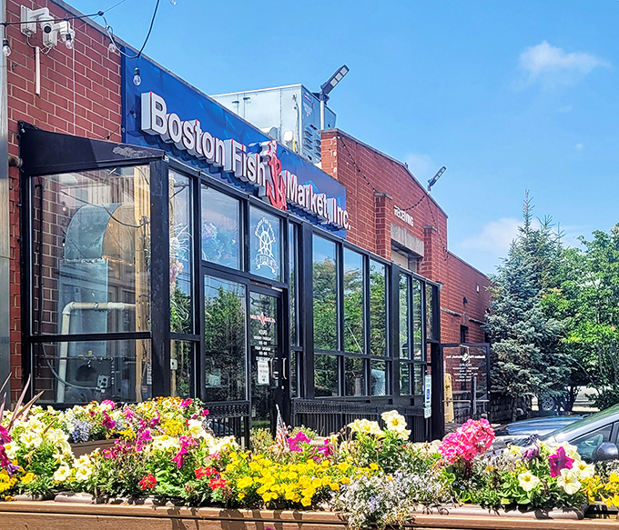 Modern glass and flowers frame this seafood haven where fresh catches meet contemporary comfort and style.