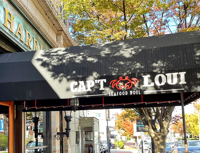 Beneath this awning, seafood magic happens! Cap't Loui's bold crab logo promises bags of steaming treasures that'll have you licking spices off your fingers.