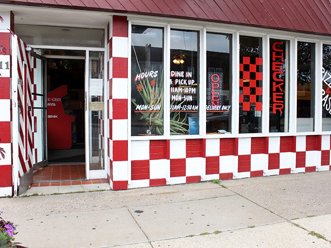 That red and white checkerboard exterior isn't playing games &ndash; it's announcing serious pizza business with retro charm to spare.