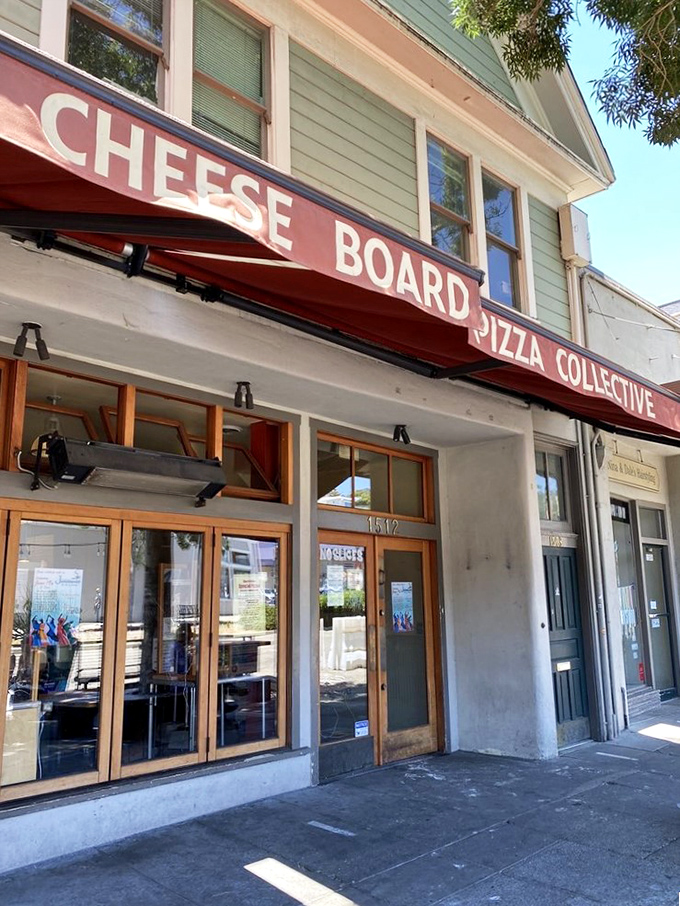 Cheese Board's simple storefront hides Berkeley's worst-kept secret. One pizza daily, and still the line forms!