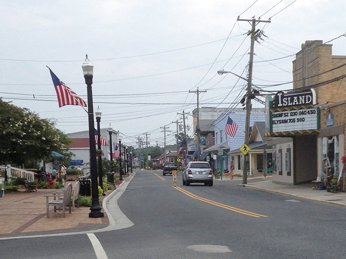 Those American flags flutter like patriotic prayer flags over a town that remembers simpler times perfectly.