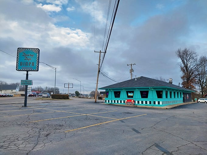 Dairy Dip Diner (exterior): "That turquoise building isn't just eye-catching &ndash; it's a beacon for burger lovers and milkshake enthusiasts alike."