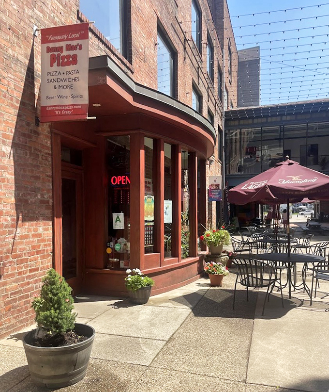 Tucked between brick buildings, Danny Mac's whispers "come inside" to those who know great pizza.