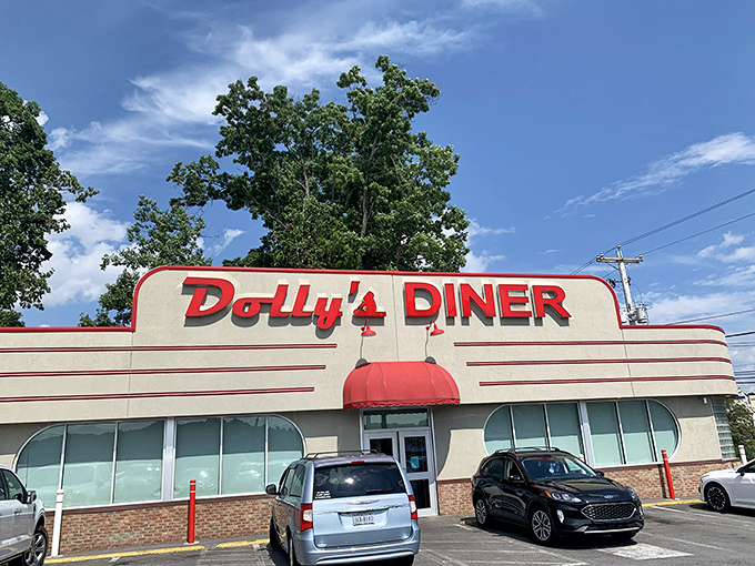 Dolly's Diner's retro facade is like a time machine with a side of fries. Those red letters have been calling hungry travelers for generations.