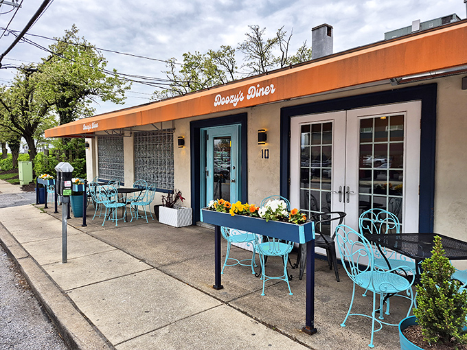 Doozy's Diner's charming orange awning and turquoise chairs invite you to sit awhile and watch the world go by.
