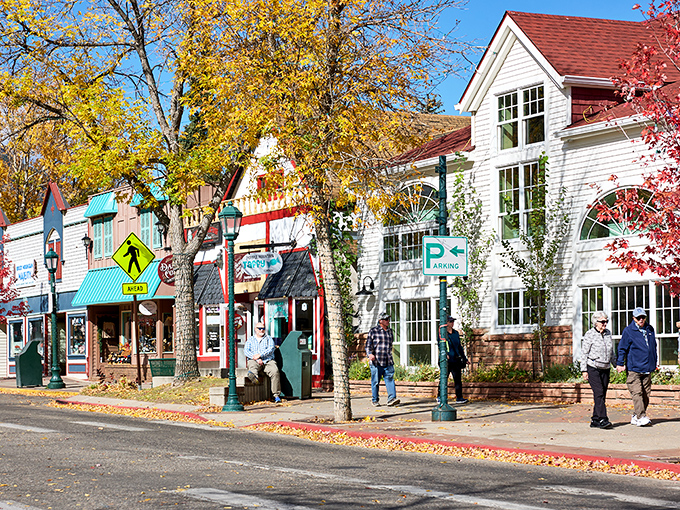 Estes Park's colorful main street welcomes visitors like a friendly mountain neighbor with open arms and elk.