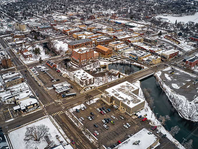 A snowy bird’s-eye view of Fergus Falls reveals its charming downtown and winding river framed by winter’s quiet beauty.