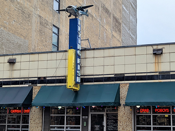 Flying Fish (exterior sign): "That vintage-style vertical sign says it all. Flying Fish brings coastal charm to downtown Memphis with retro flair."