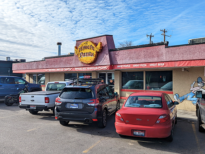 Flying Pie's retro pink exterior promises pizza with personality and toppings that don't know when to quit.