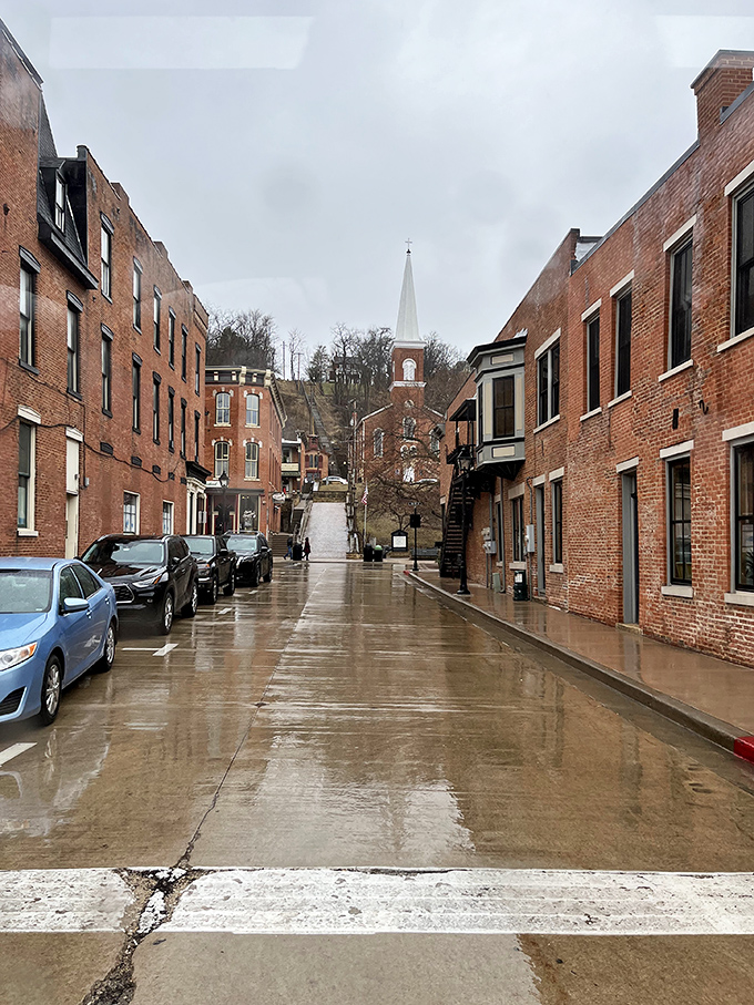 Rain-slicked cobblestones leading to heaven! Galena's uphill climb rewards with church spires piercing clouds like something straight out of a Gothic romance novel.