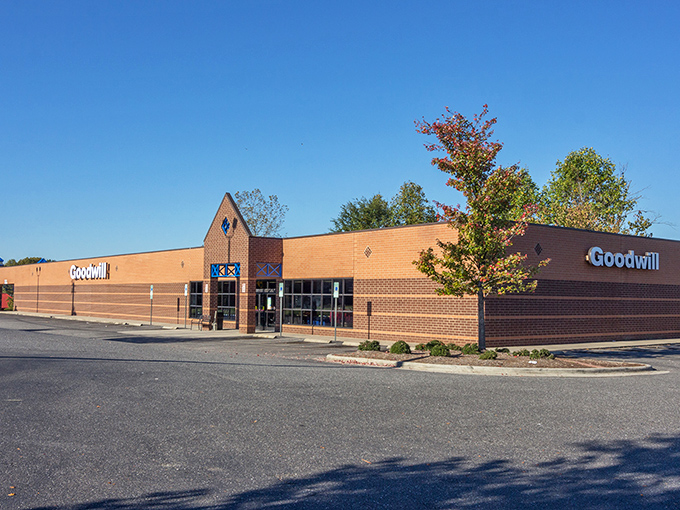 Goodwill's brick facade stands ready for treasure hunters in Lowell. The Fort Knox of secondhand finds awaits behind those windows!