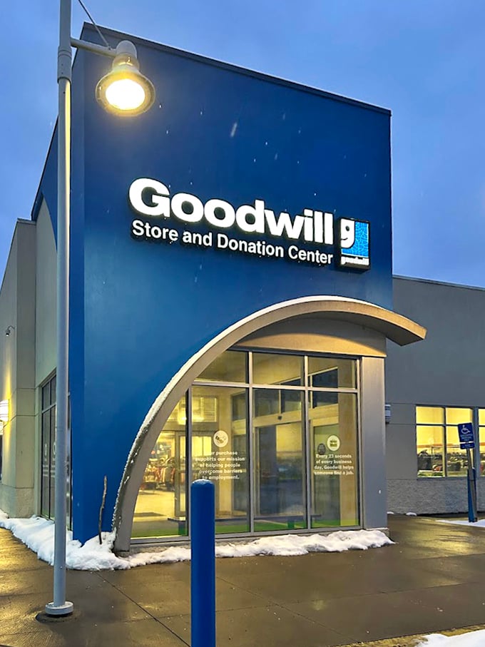 Goodwill's modern blue storefront in Morgantown shines like a secondhand sapphire under the evening sky.
