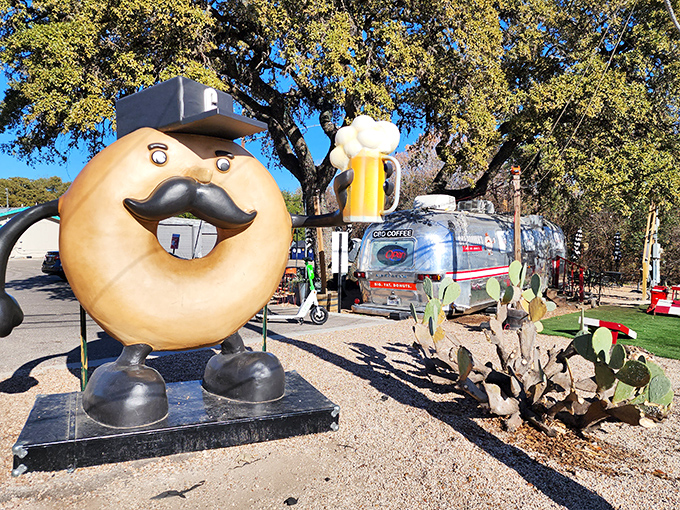 Meet the unofficial mayor of Donut Town&mdash;a mustachioed pastry with a beer. This giant donut mascot at Gourdough's is living his best life under Austin's oak trees.