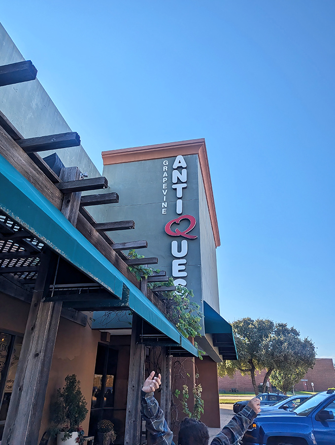 Grapevine Antique Queens stands tall against the Texas sky, beckoning collectors with its distinctive vertical signage.