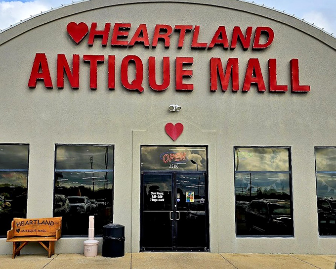 Heartland Antique Mall's cheerful red sign with that adorable heart – like your grandmother's warm welcome in building form.