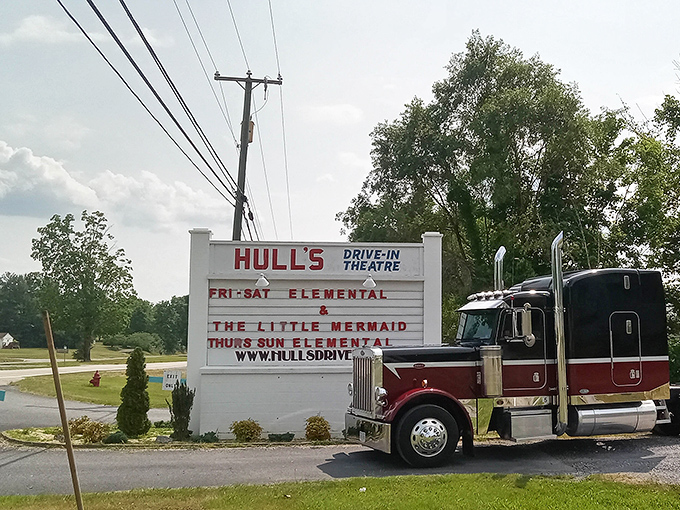 Hull's marquee announces tonight's features with vintage charm. Even the passing truck seems to slow down for a peek!