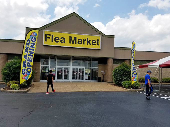 Yellow banners announce bargain central! I-75 Flea Market's clean storefront promises air-conditioned treasure hunting regardless of Georgia's fickle weather.