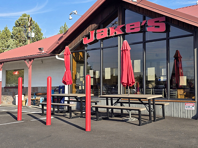 Jake's bold red roof and patio scream "stop here for comfort food!" Like a lighthouse for the hungry, guiding you to burger paradise.