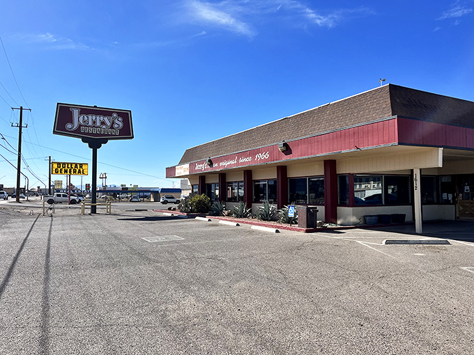 Jerry's Restaurant sign stands tall against the desert sky – a beacon of hope for hungry travelers since bell-bottoms were in fashion.