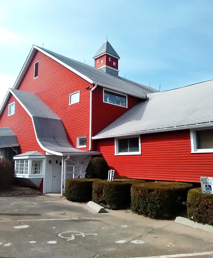 This red barn stands proud like a beacon for bargain hunters, practically shouting "treasures inside!"