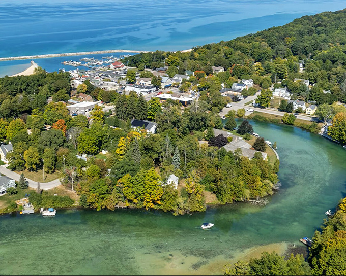 From this bird's-eye view, crystal-clear waters cradle a community that looks like it was designed by someone who really understood the art of peaceful living.