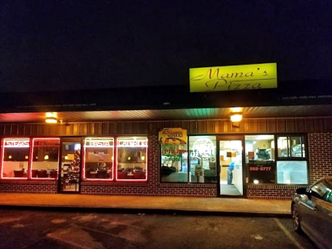 That glowing yellow sign beckons like a lighthouse for hungry souls seeking late-night pizza perfection.