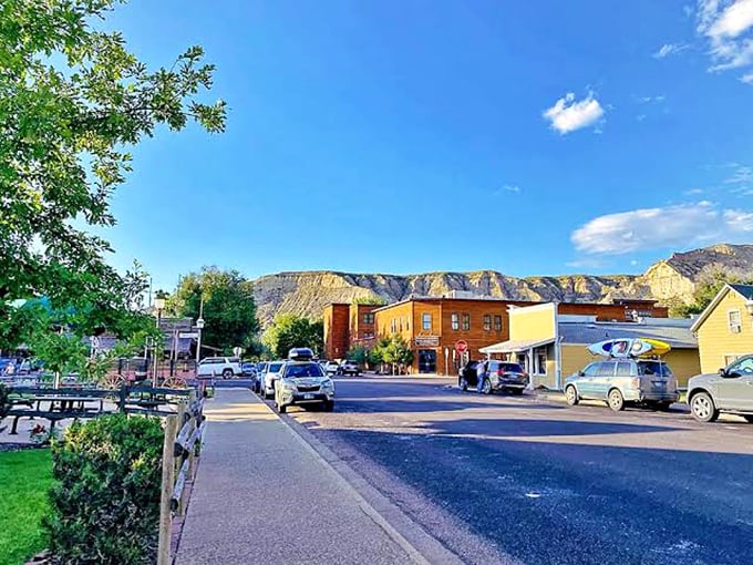 Medora's main drag stretches beneath dramatic Badlands cliffs that make skyscrapers look downright boring by comparison.