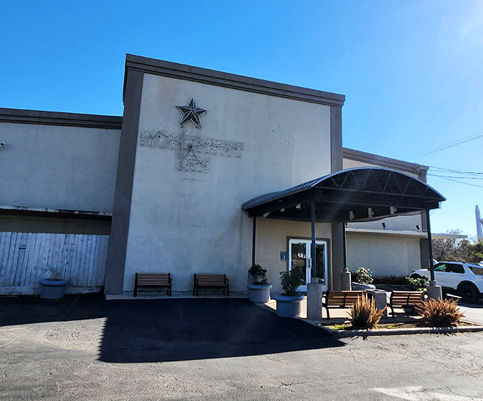 Monument Inn's unassuming exterior hides a seafood paradise where diners can watch massive ships pass by while enjoying fresh Gulf catches.
